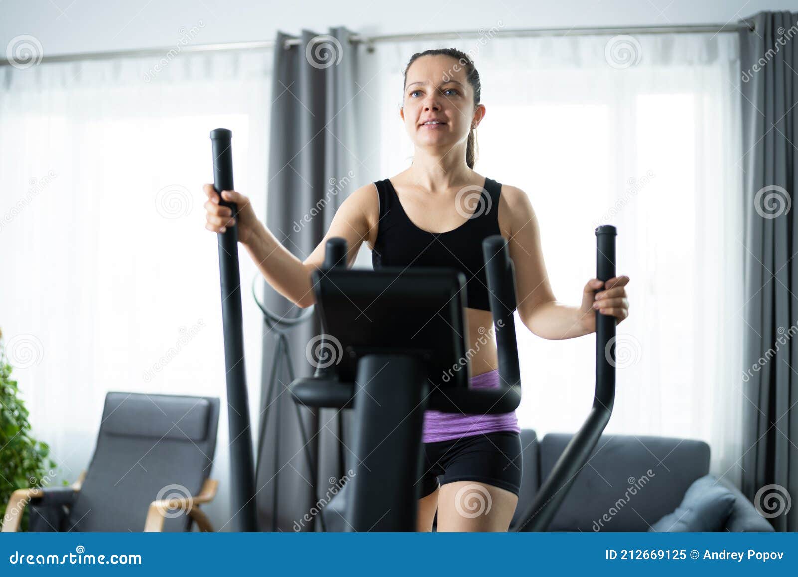 Woman Training on Elliptical Trainer Stock Image - Image of trainer ...