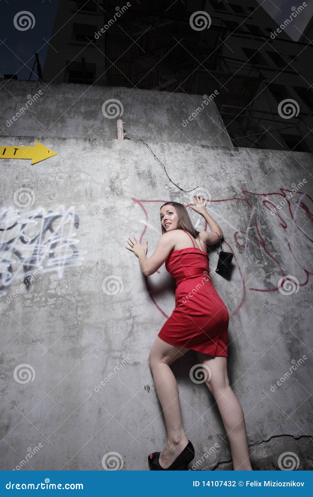 Woman Trapped Against a Wall Stock Photo - Image of horizontal ...