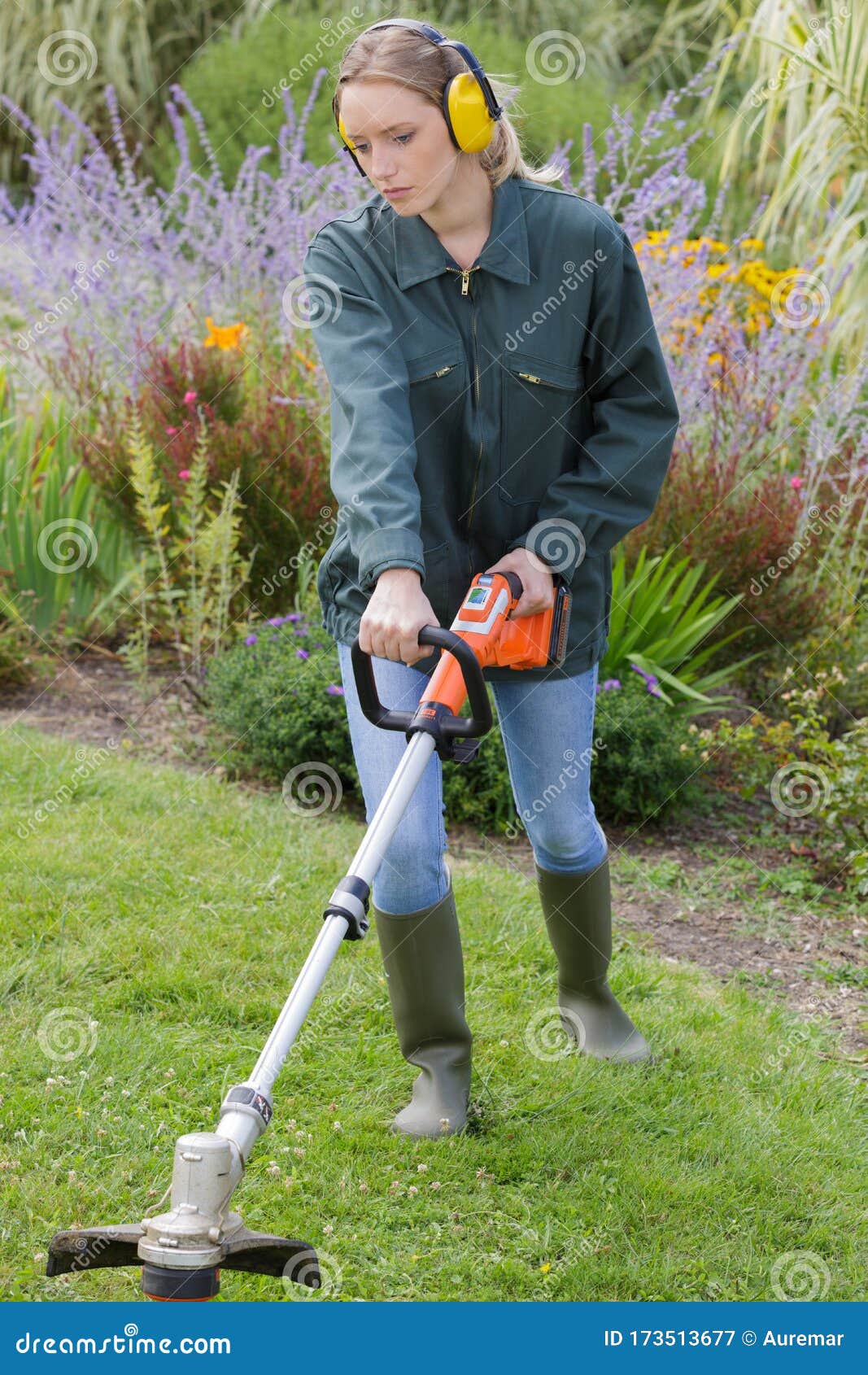Woman trims lawn stock image. Image of asia, trimmer - 173513677