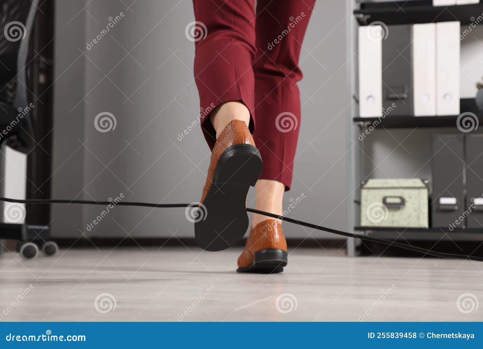 Woman Tripping Over Cable in Office, Closeup Stock Photo - Image of ...