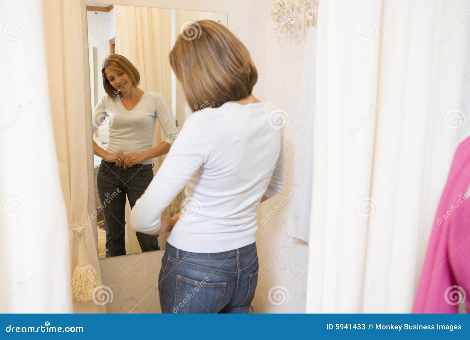 Woman Trying on Jeans and Smiling Stock Image - Image of length ... Woman Trying on Jeans and Smiling Stock Image - Image of length ...