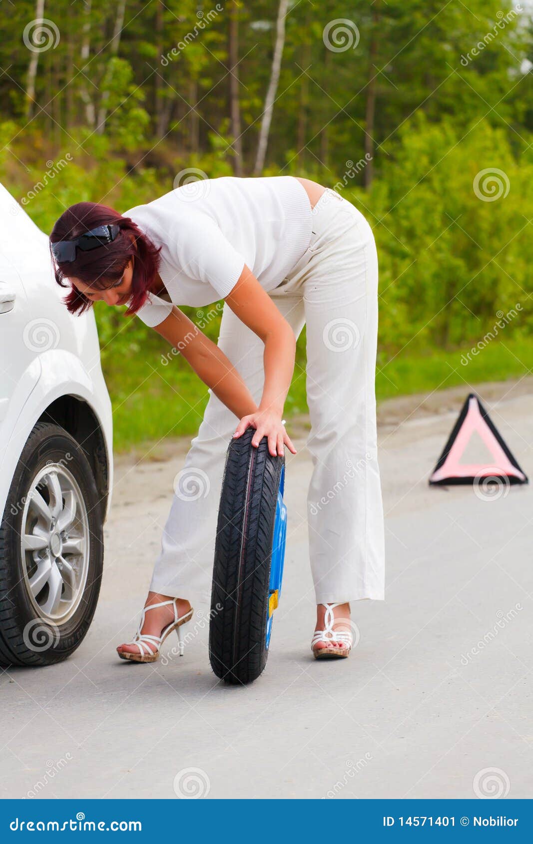 Woman Trying To Change the Wheel Stock Image - Image of female, pretty ...