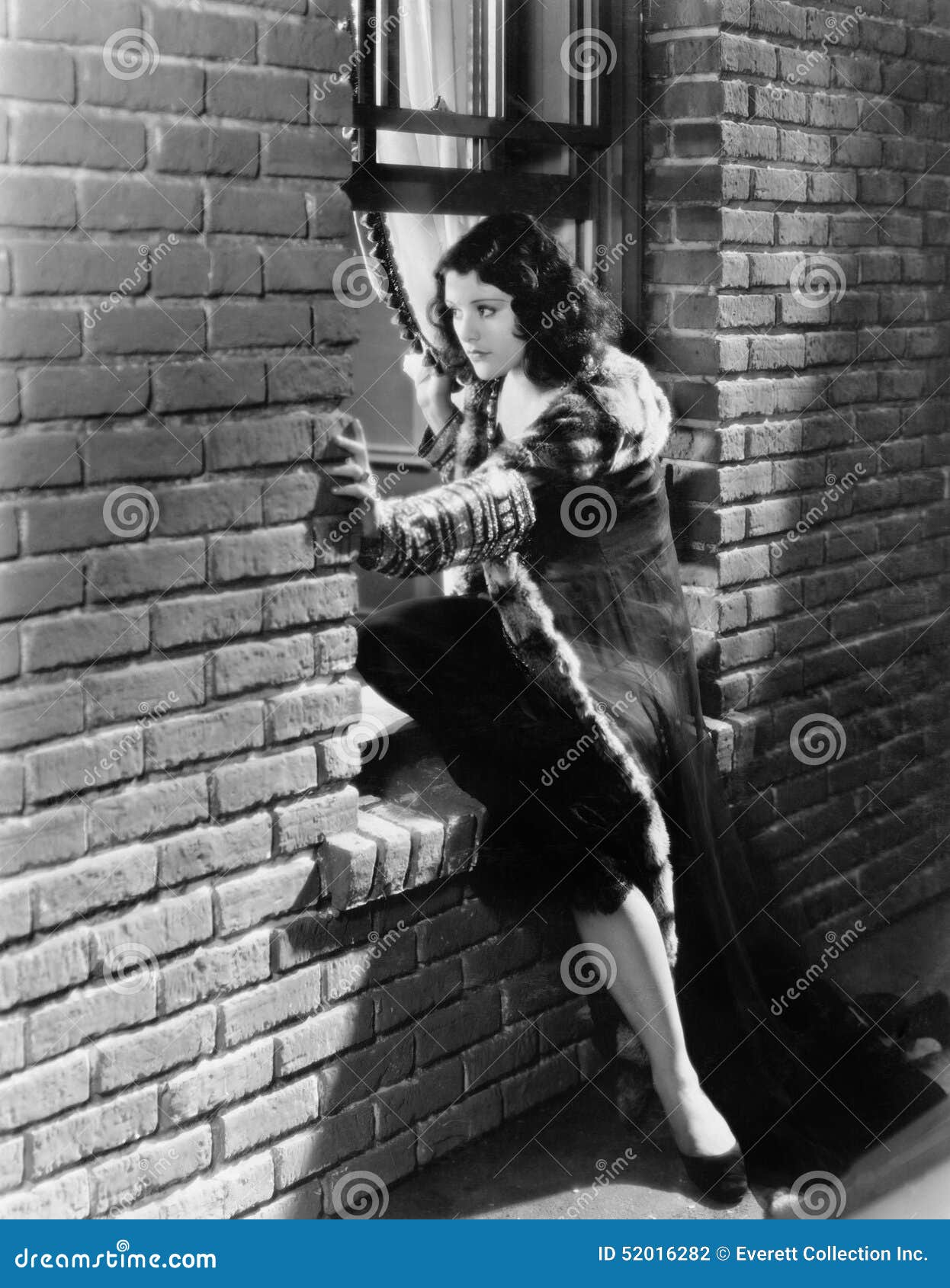 Woman Trying To Escape through a Window Stock Photo - Image of dressed ...