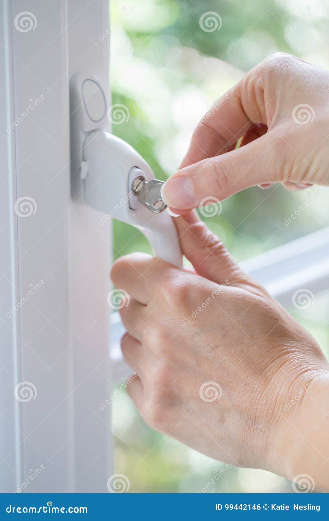 Close Up of Woman Turning Key in Window Lock Stock Photo - Image of ...