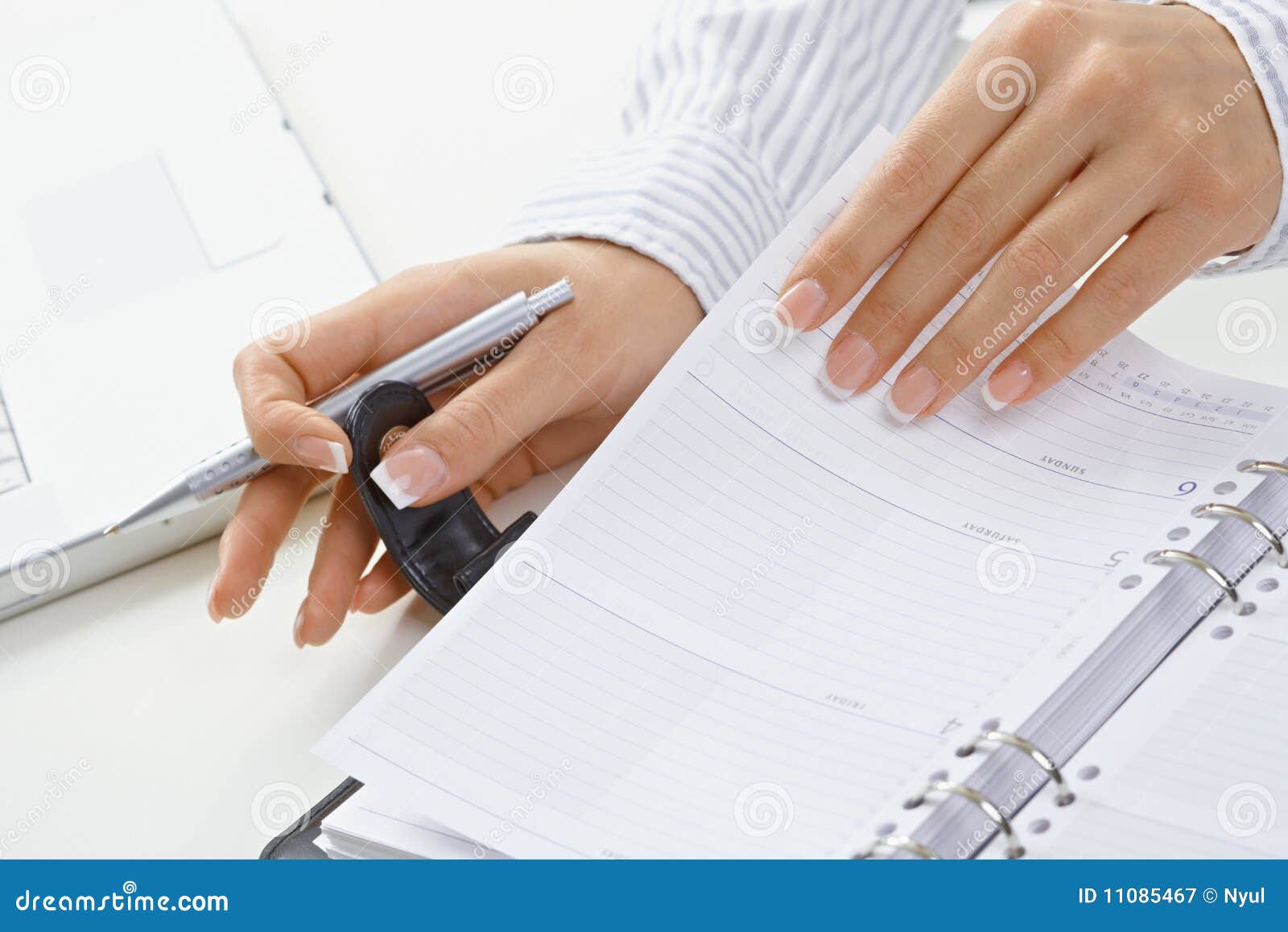 Woman Turning Notebook Page Stock Image - Image of hand, nail: 11085467
