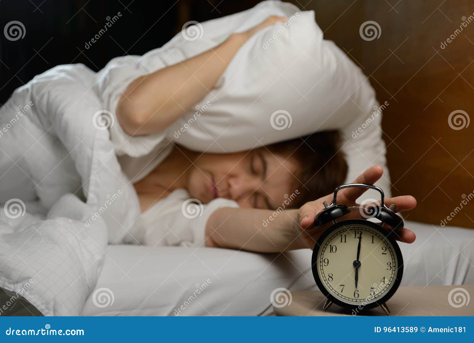 Woman Turning Off the Alarm Clock Stock Image - Image of tired, lying ...