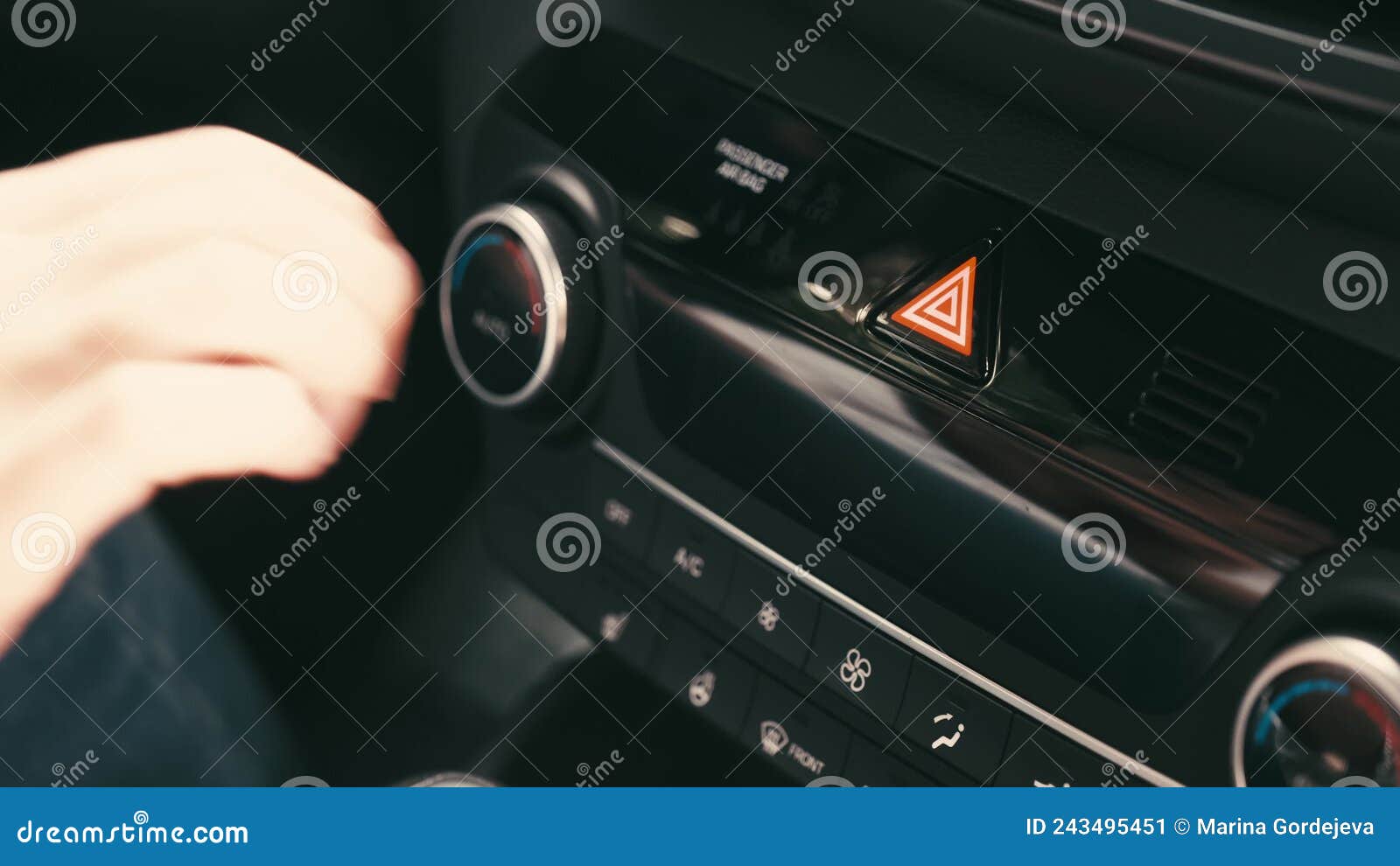 A Woman Turns on the Emergency Button in a Modern Car. Close-up of a ...