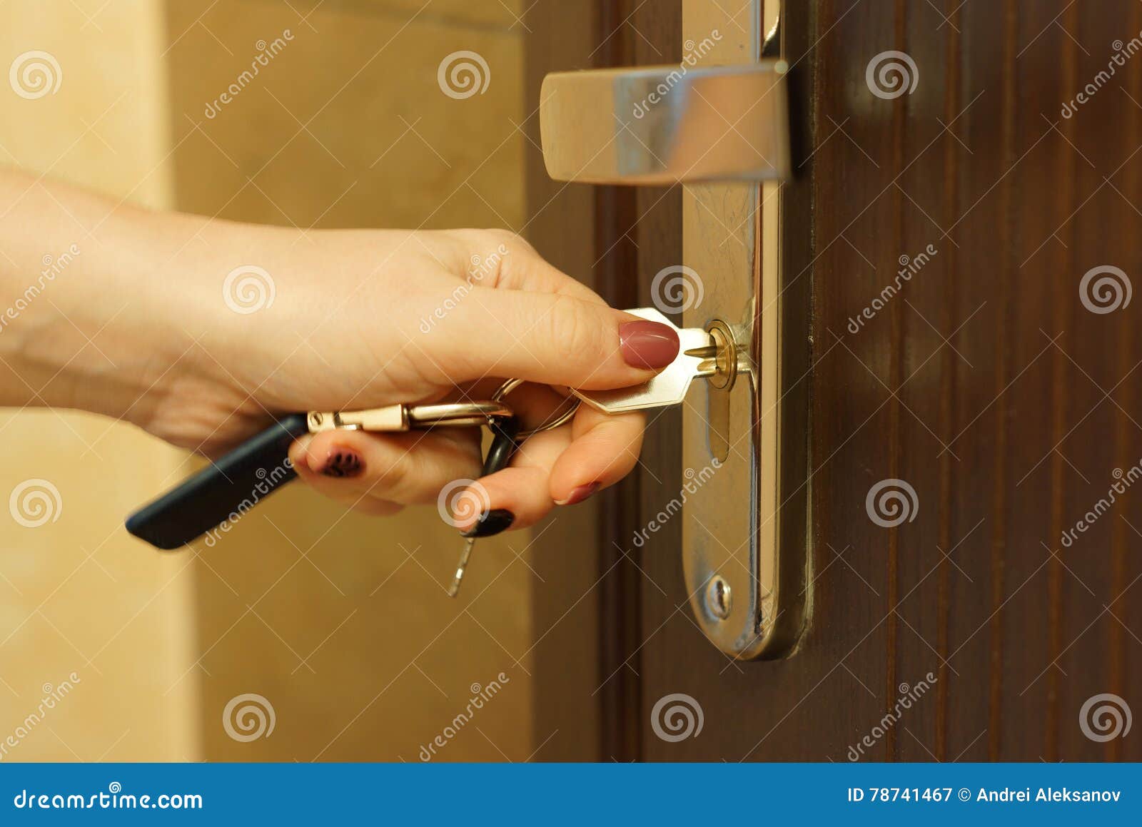 Woman Turns the Key in a Lock on an External Door Stock Image - Image ...