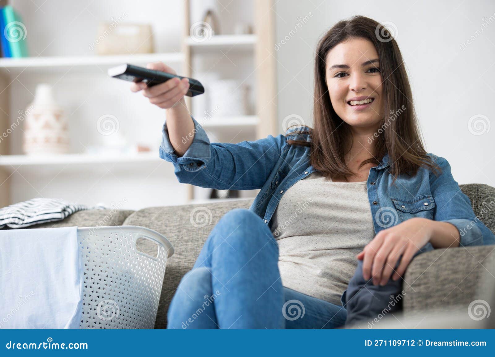 Woman with Tv Remote Control on Sofa Stock Photo - Image of young ...