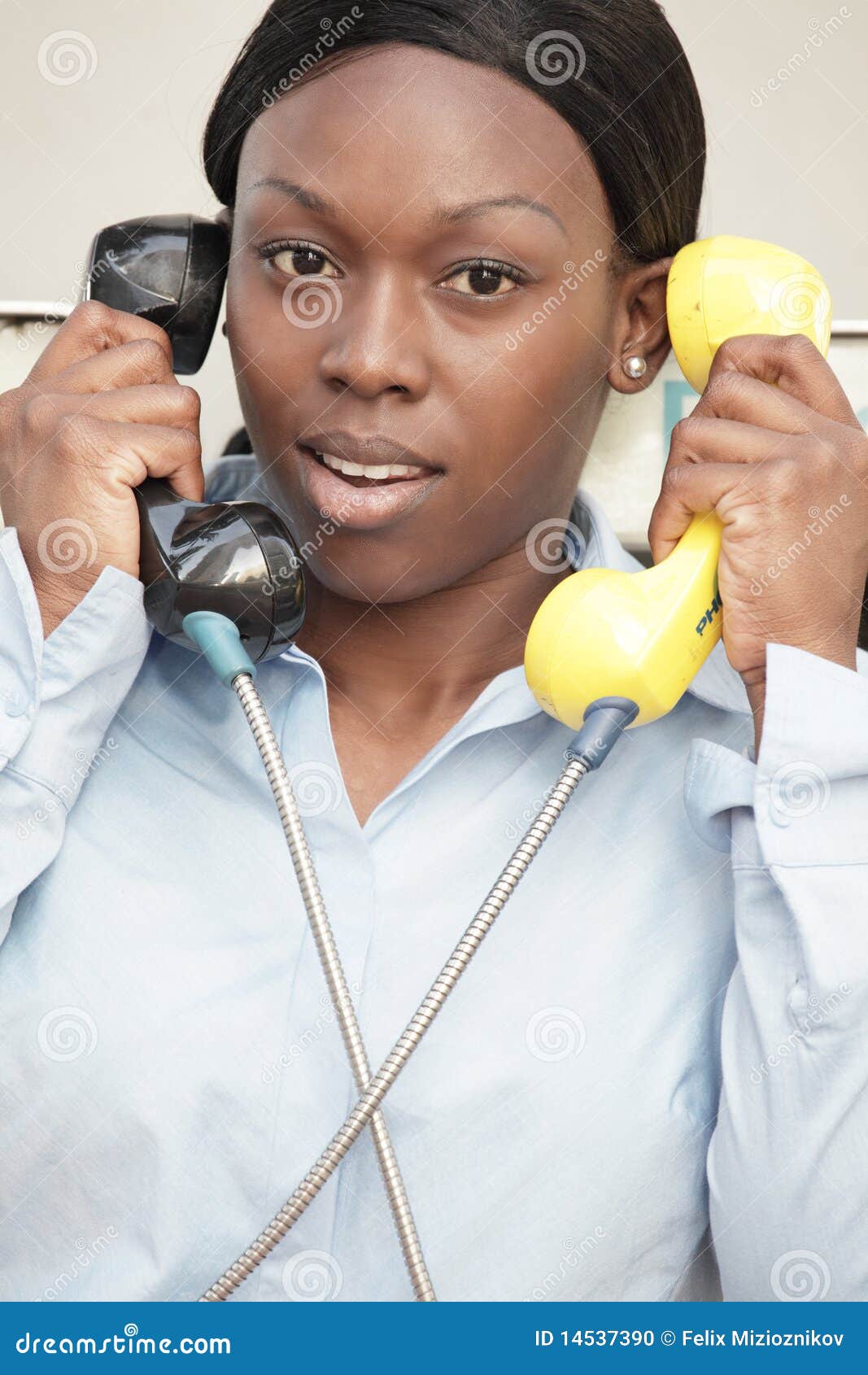 Woman on two phones stock photo. Image of hairstyle, beauty - 14537390