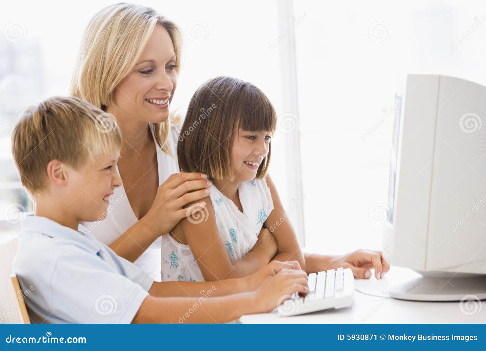 Woman and Two Young Children with Computer Stock Image - Image of ...