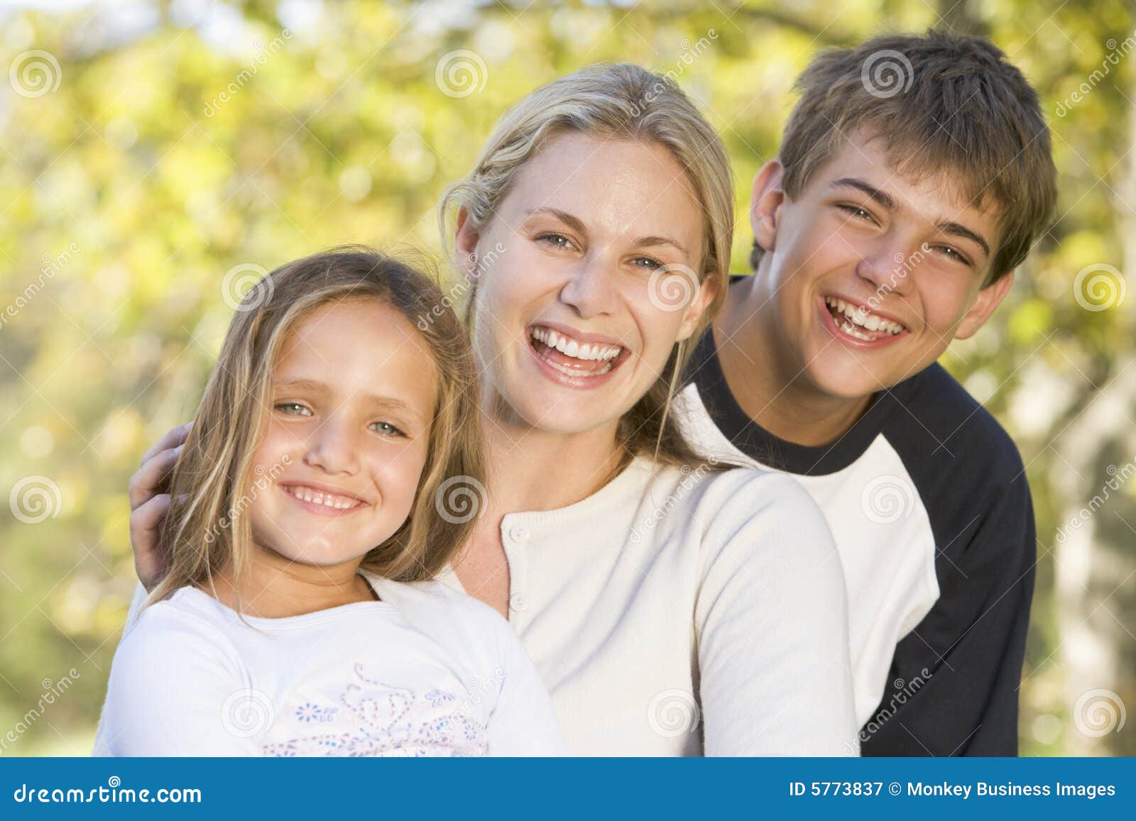 Woman with Two Young Children Outdoors Smiling Stock Image - Image of ...