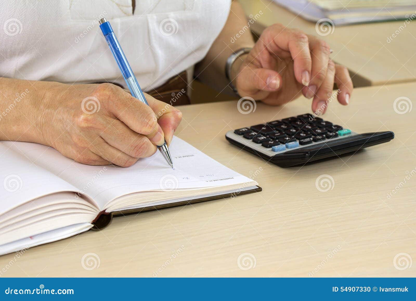 Woman typing on calculator stock photo. Image of boss - 54907330