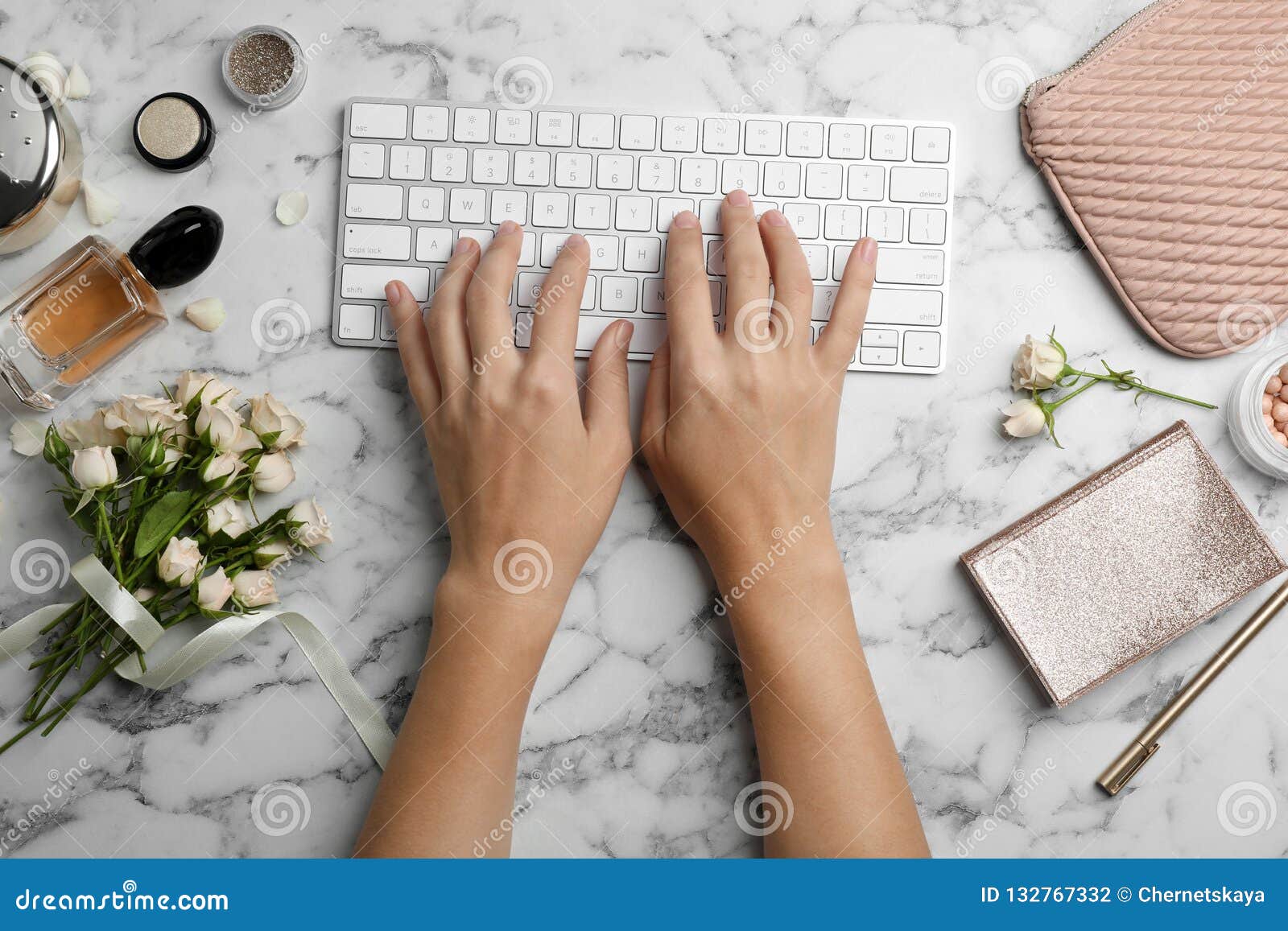 Woman Typing on Keyboard at Table with Beautiful Roses Stock Photo ...