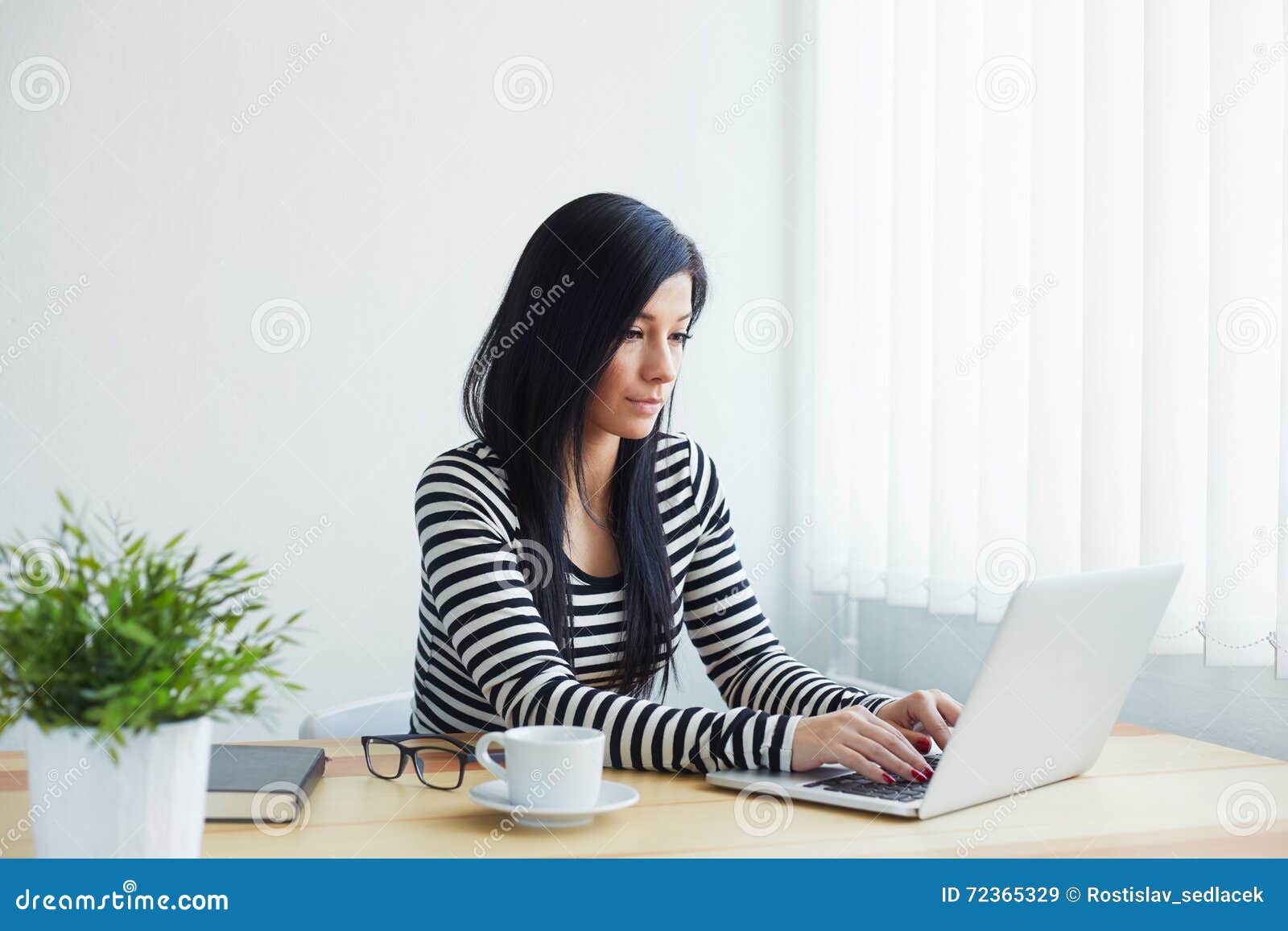 Woman typing on laptop stock image. Image of beautiful - 72365329