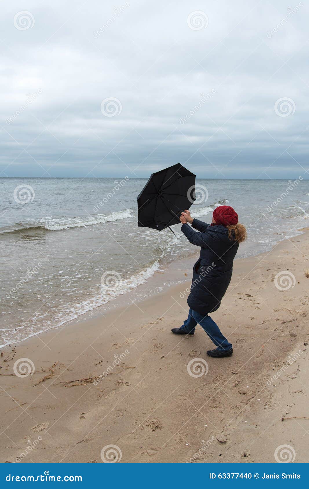 Woman and umbrella. stock photo. Image of windy, coast - 63377440