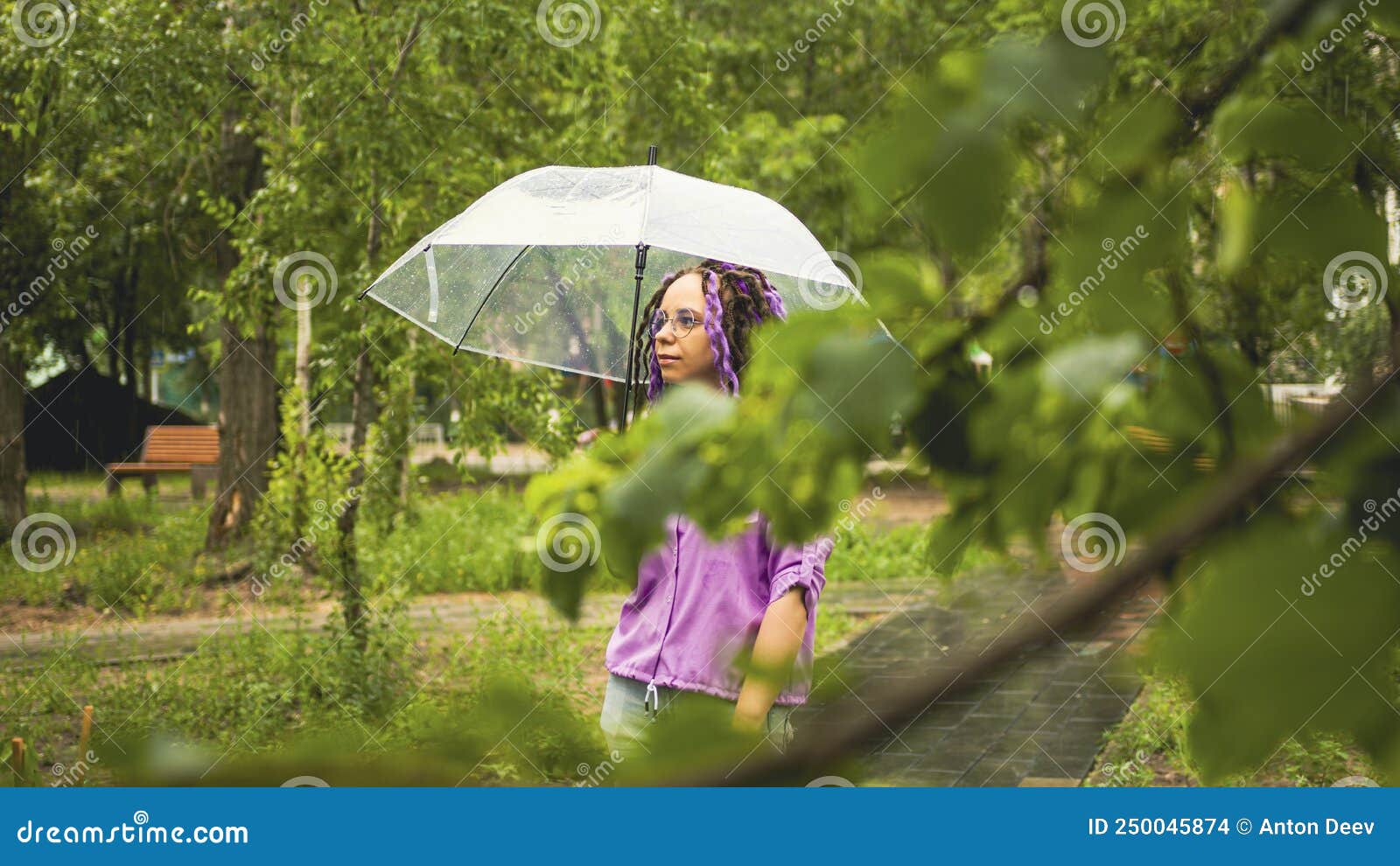 A Woman With Umbrella In Hand In The Rain Girl With Glasses Under An
