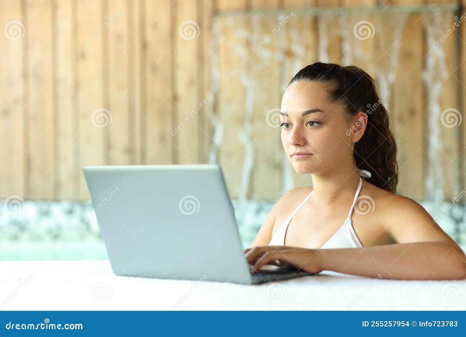 Woman Using Laptop in a Spa Stock Photo - Image of lifestyle, bathing ...