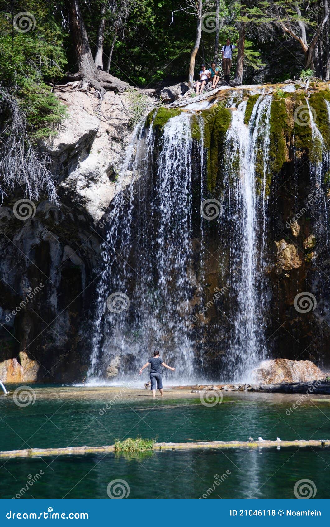 Woman under a waterfall editorial stock photo. Image of lake - 21046118