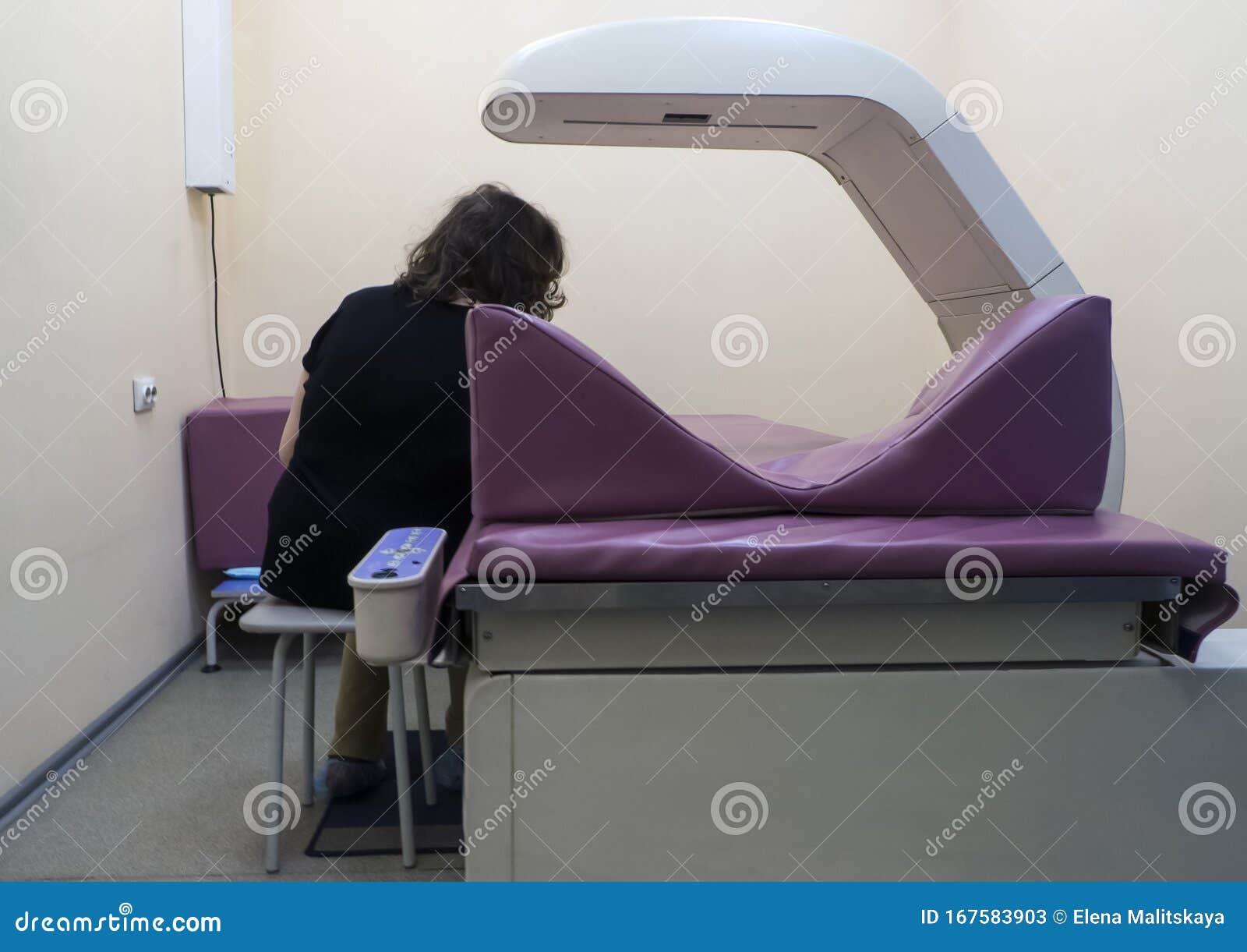 A Woman Undergoes a Study - Bone Densitometry of the Hands. Detects a ...