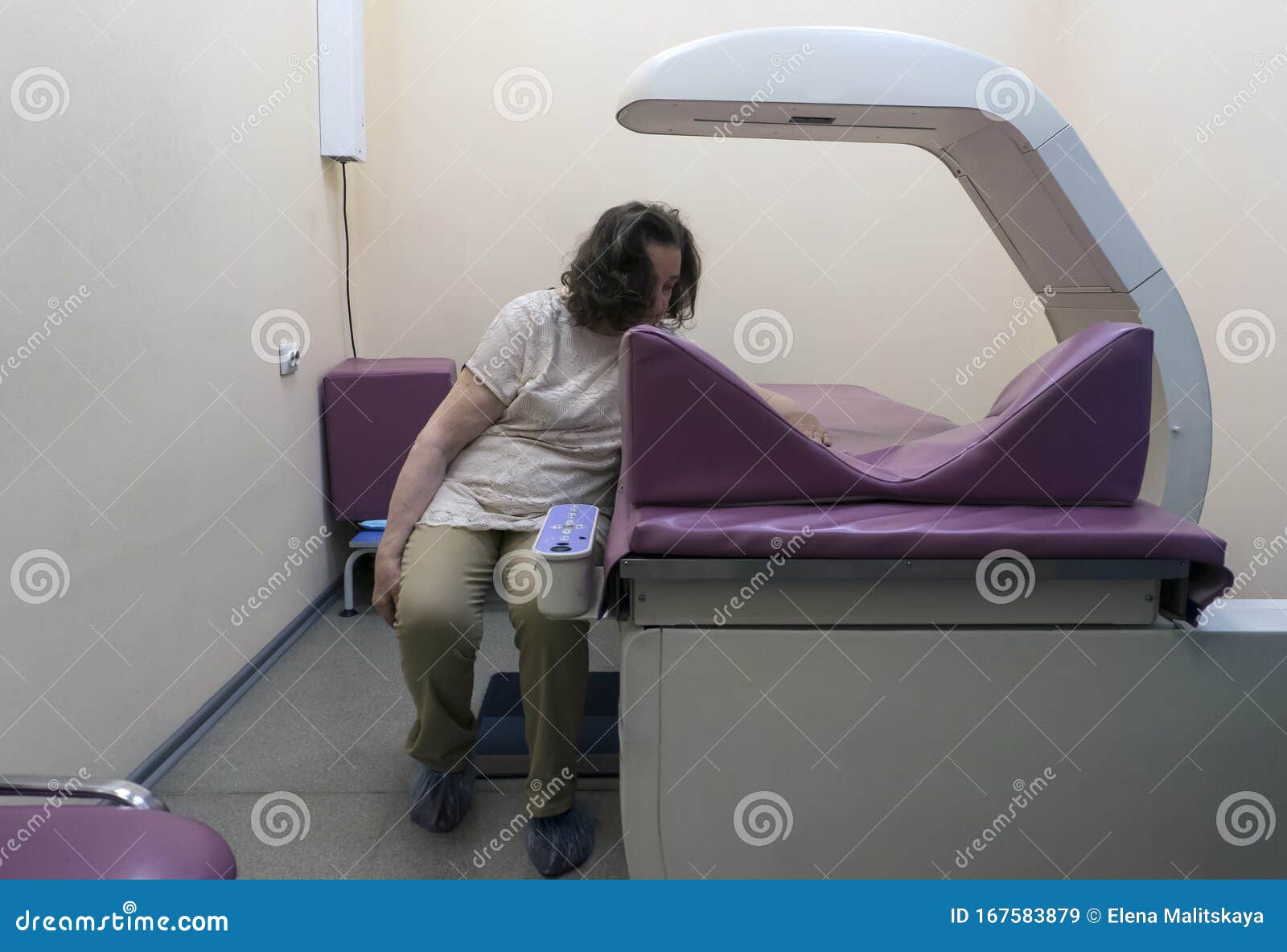 A Woman is Undergoing Research for Osteoporosis, Bone Densitometry of ...