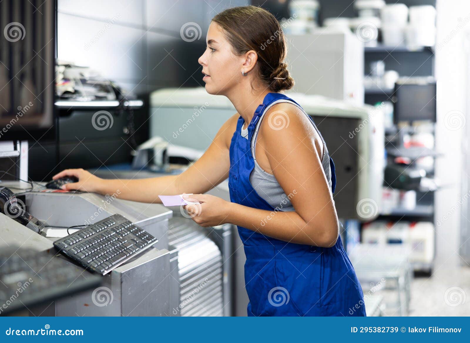 Woman in Uniform Operating Computerised Machne To Mix Paint Stock Image ...