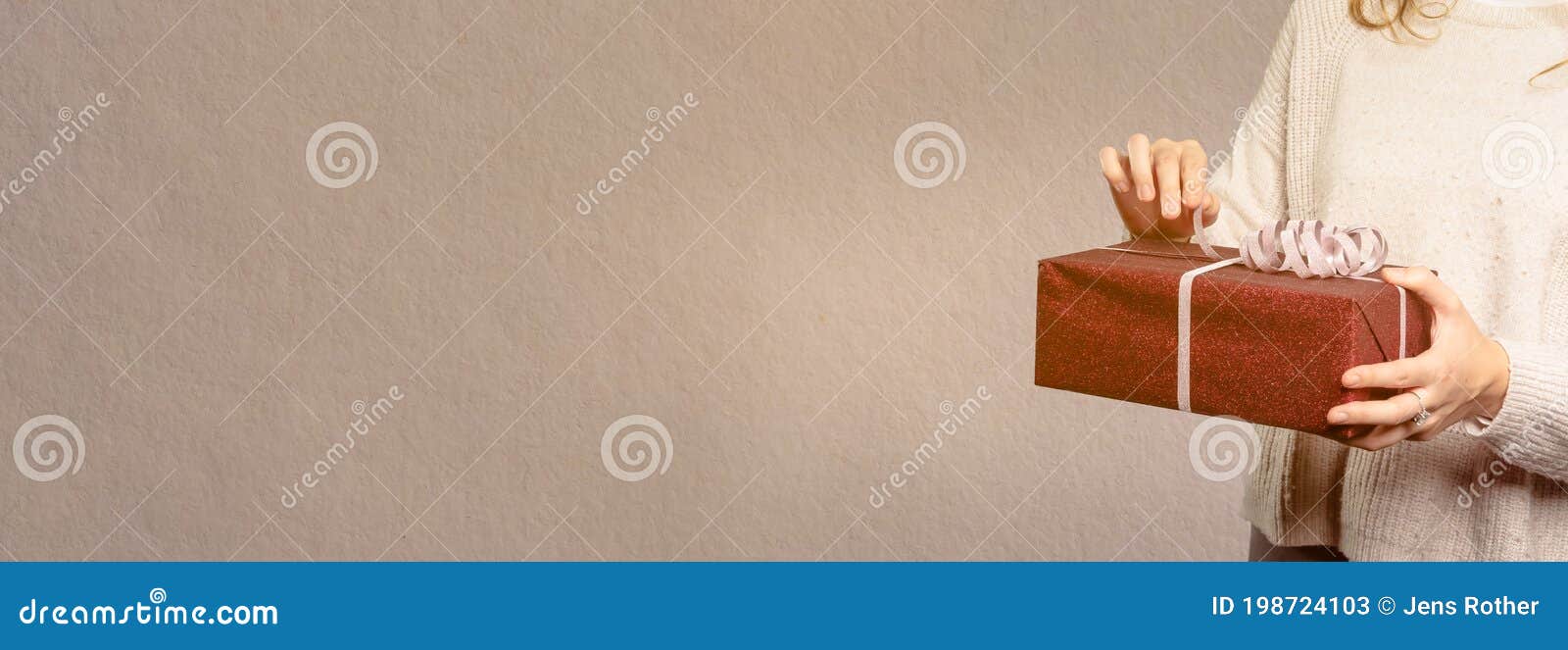 A Woman is Unwrapping a Gift with Text-free Space Stock Image - Image ...