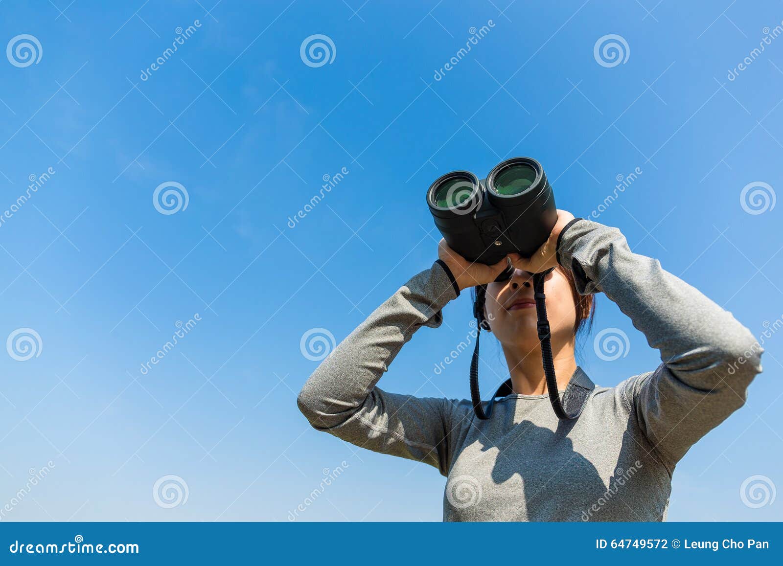 Woman use the binoculars stock photo. Image of discovery - 64749572