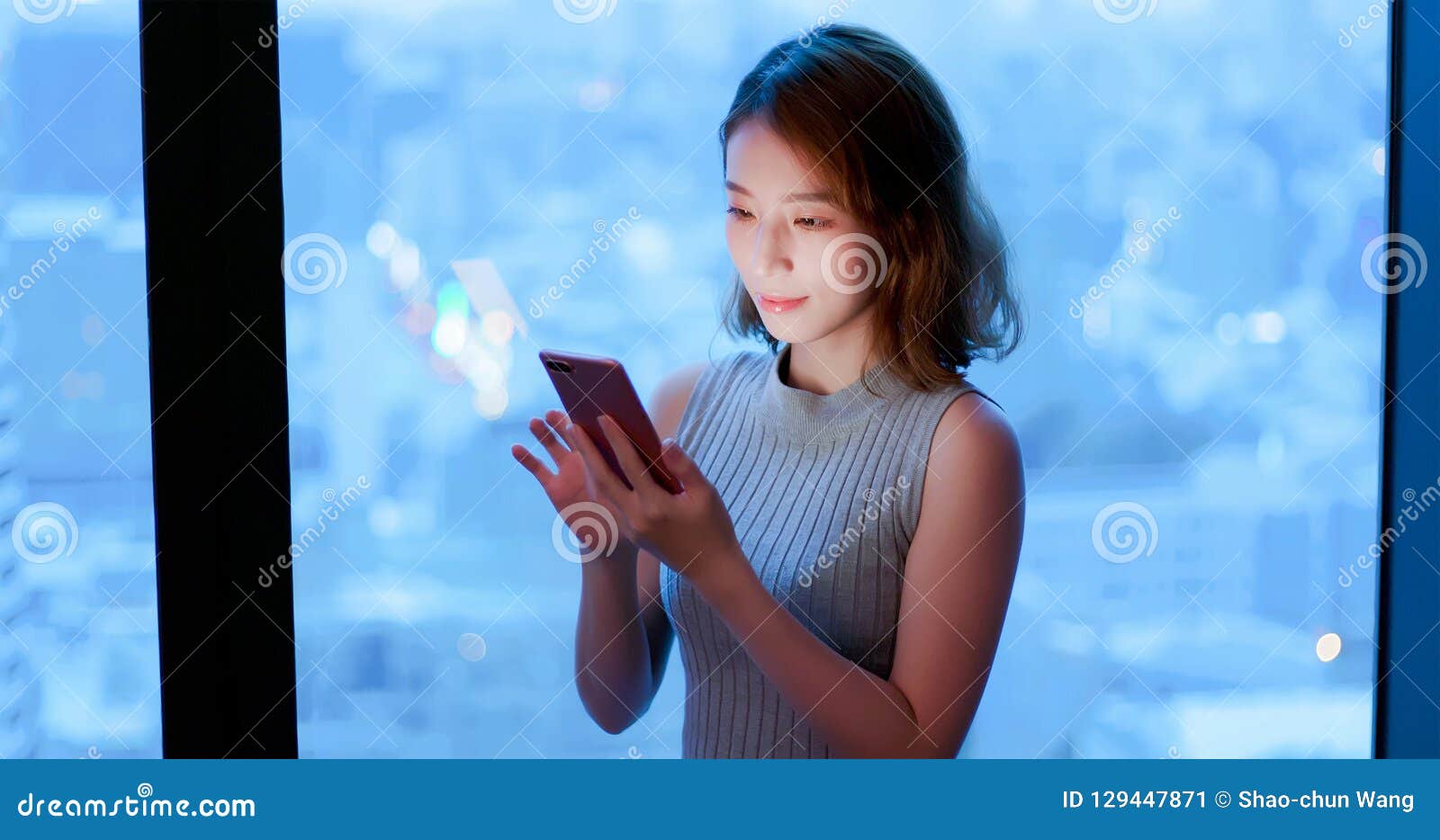 Woman use phone happily stock image. Image of dark, internet - 129447871
