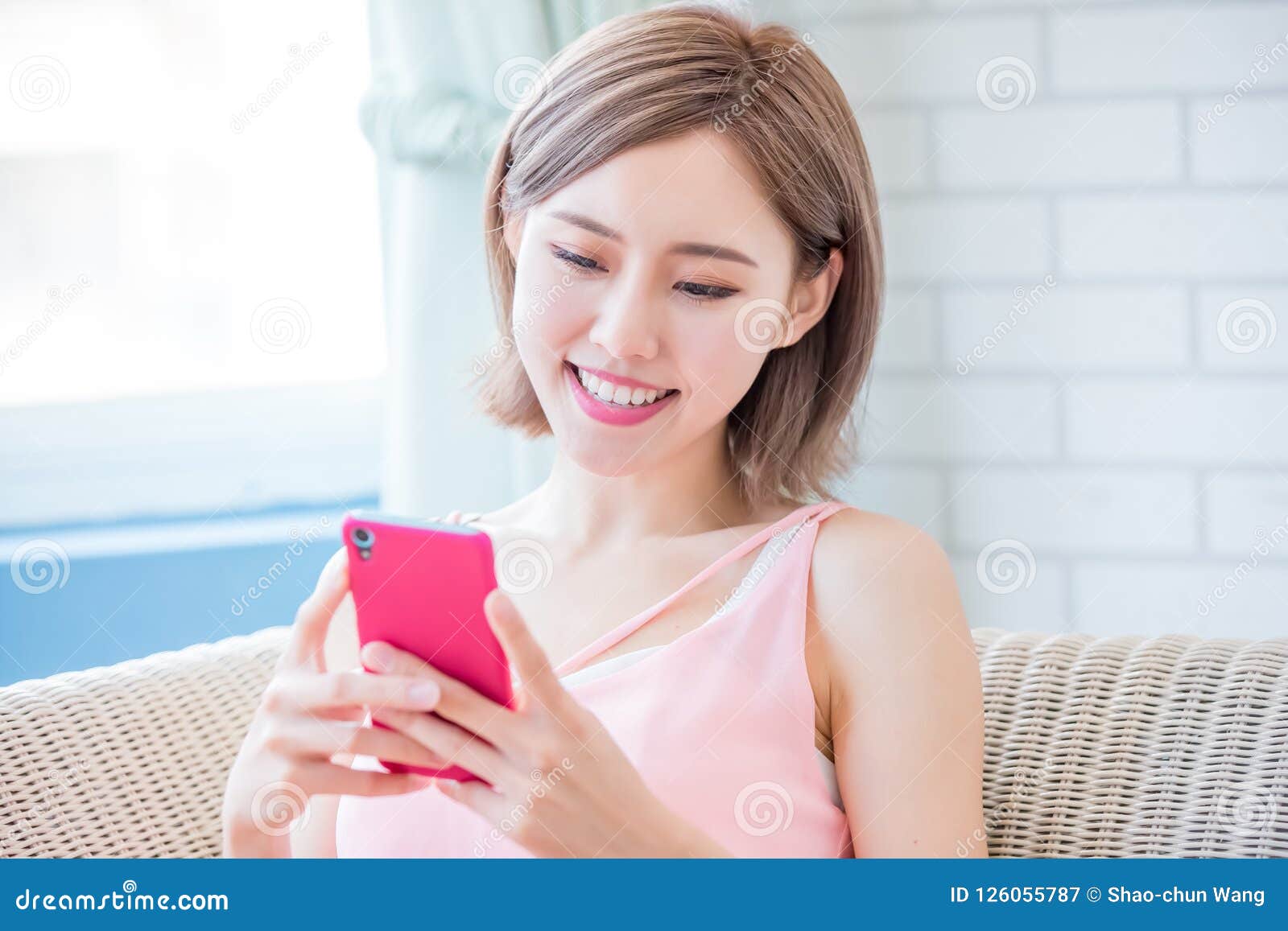 Woman use phone happily stock image. Image of residential - 126055787