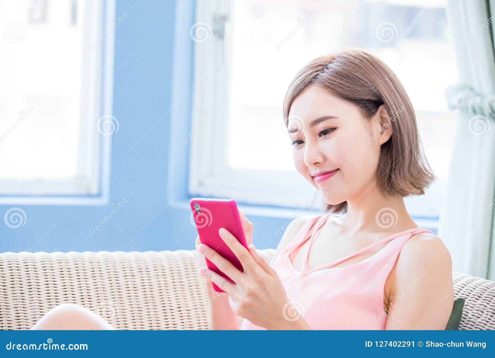 Woman use phone happily stock image. Image of asia, phone - 127402291