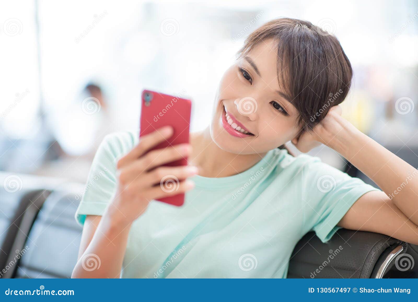 Woman use phone happily stock image. Image of call, girl - 130567497
