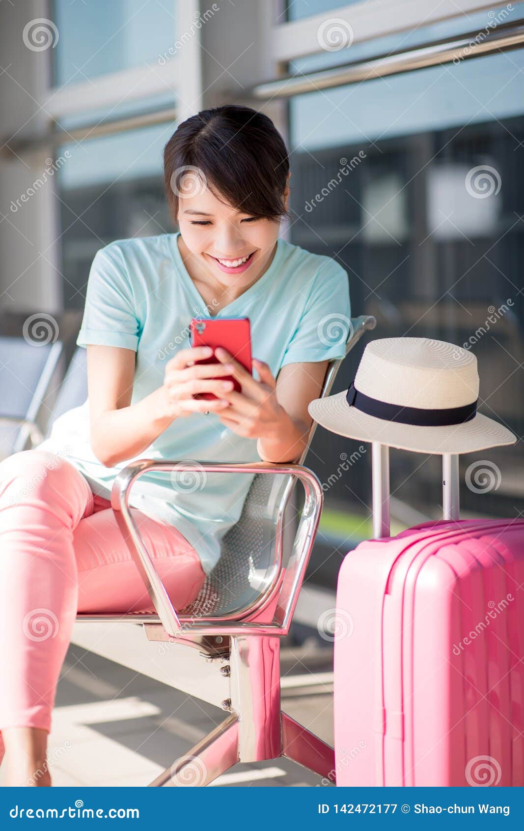 Woman use phone happily stock image. Image of people - 142472177