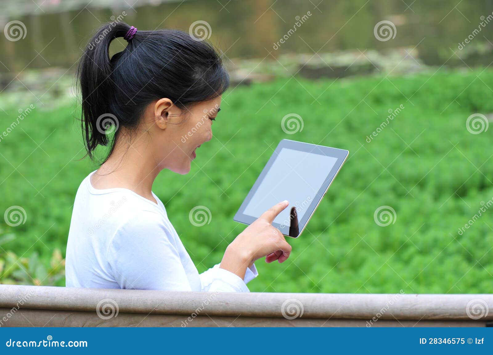 Woman use tablet outdoor stock image. Image of hands - 28346575