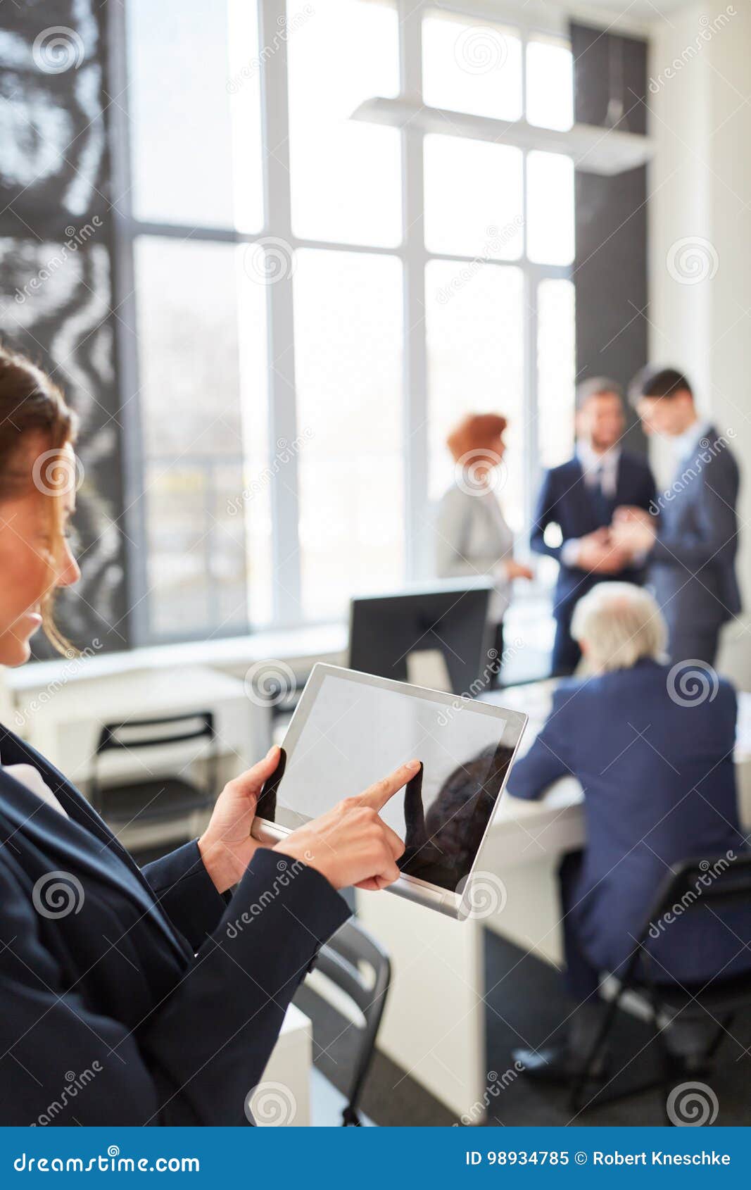 Woman uses tablet computer stock image. Image of office - 98934785