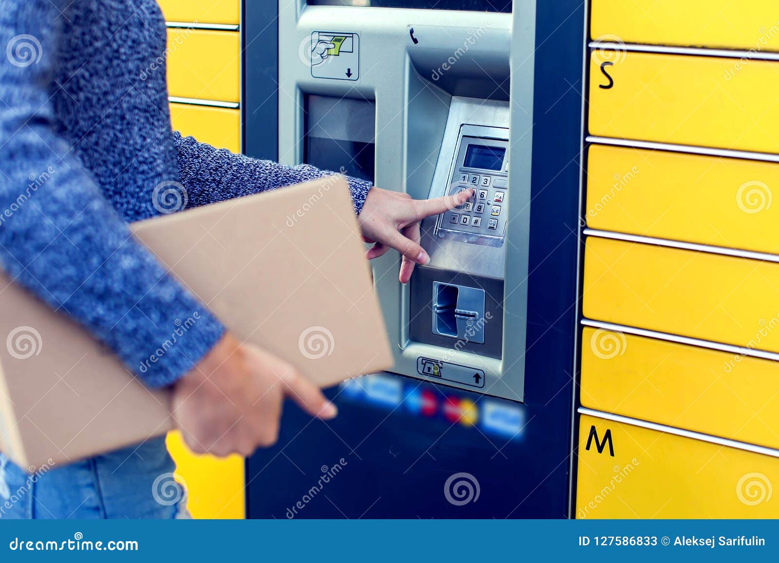 Woman Using Automated Self Service Post Terminal Machine or Lock Stock ...