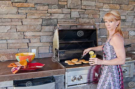 Woman using barbeque grill stock photo. Image of grill - 21189268