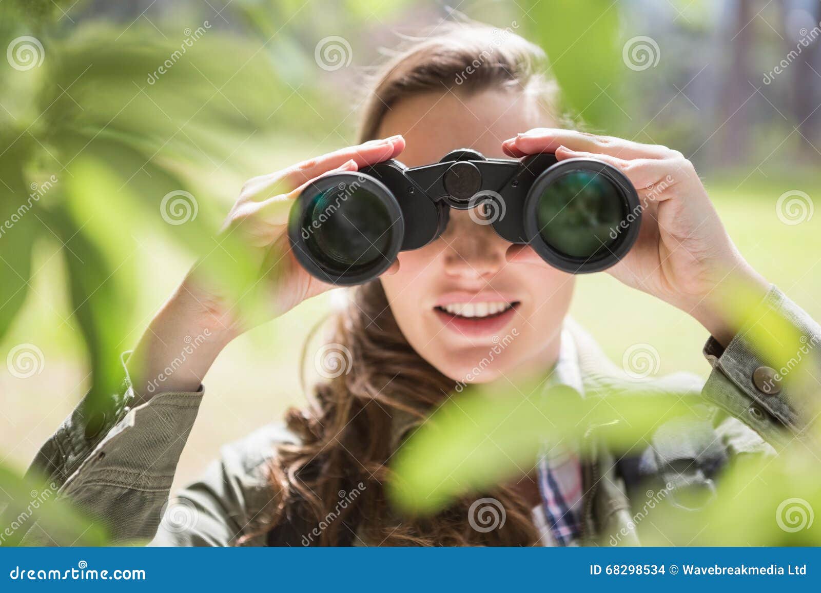 Woman using binoculars stock photo. Image of adult, adventurer - 68298534