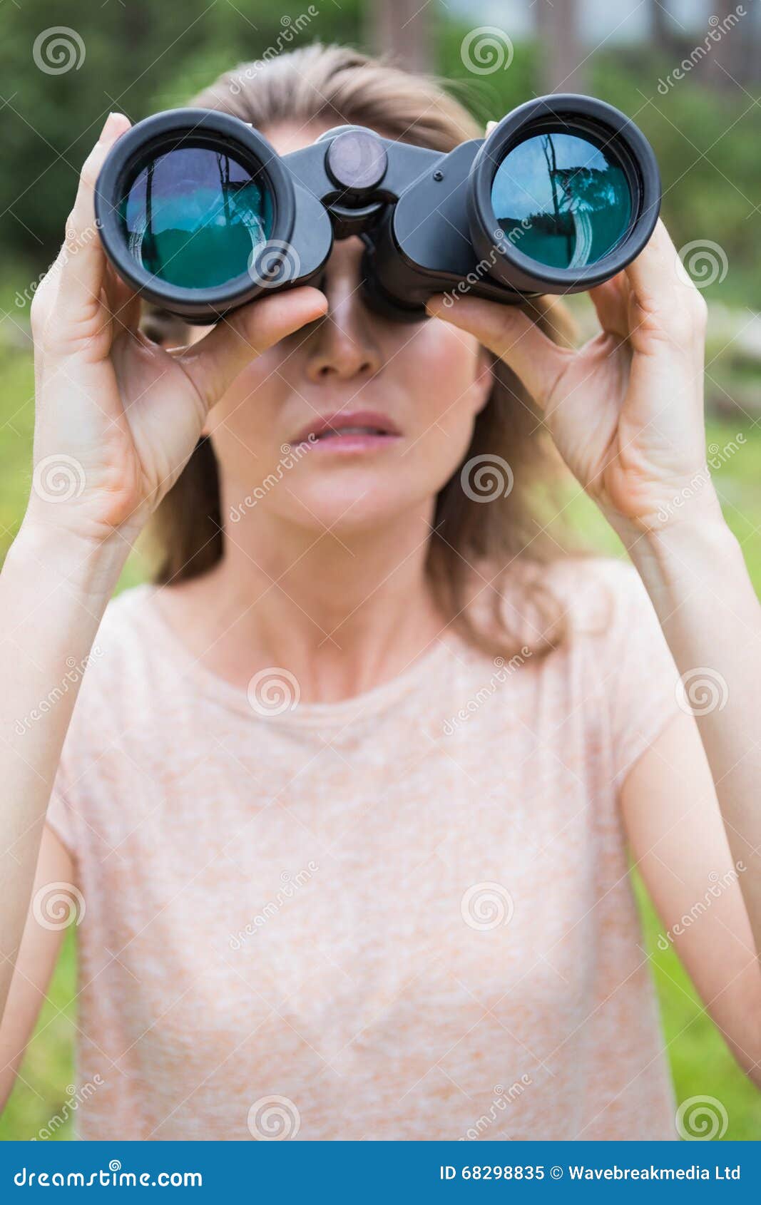 Woman using binoculars stock image. Image of pathway - 68298835