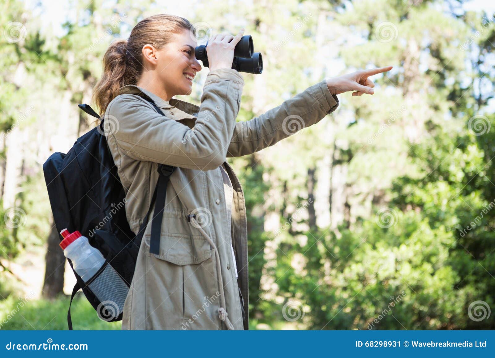 Woman using binoculars stock image. Image of outdoorsy - 68298931
