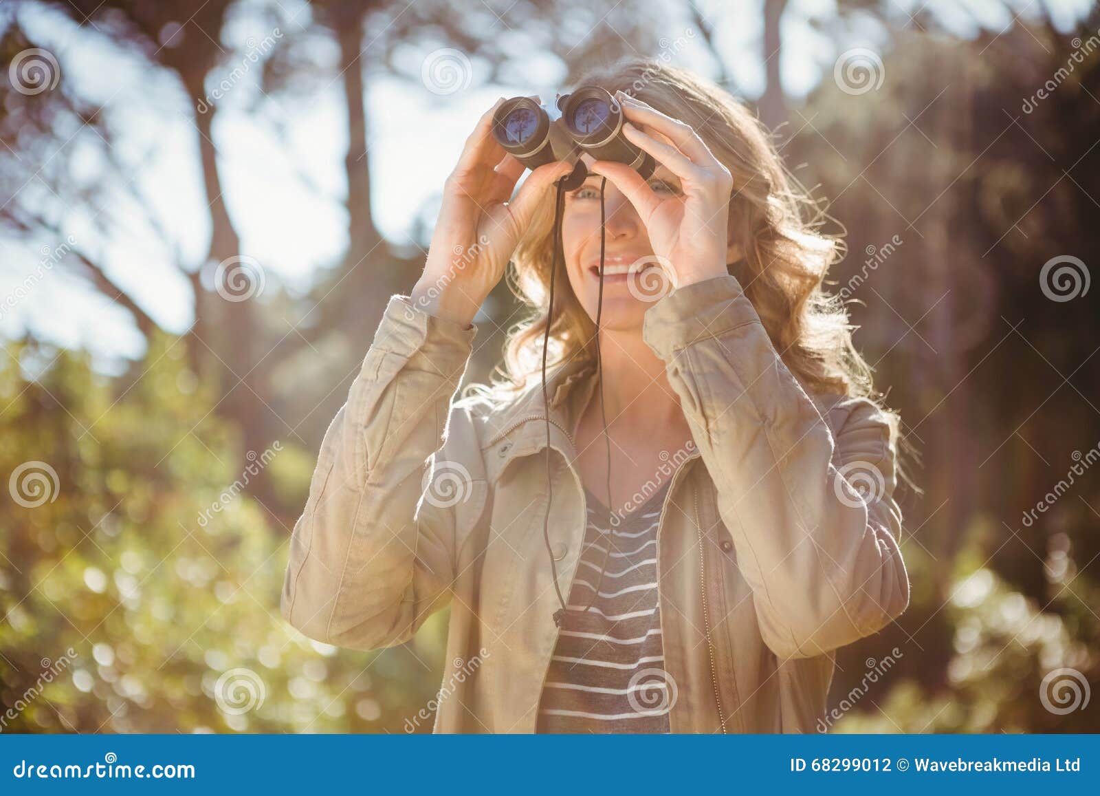 Woman using binoculars stock photo. Image of greenery - 68299012