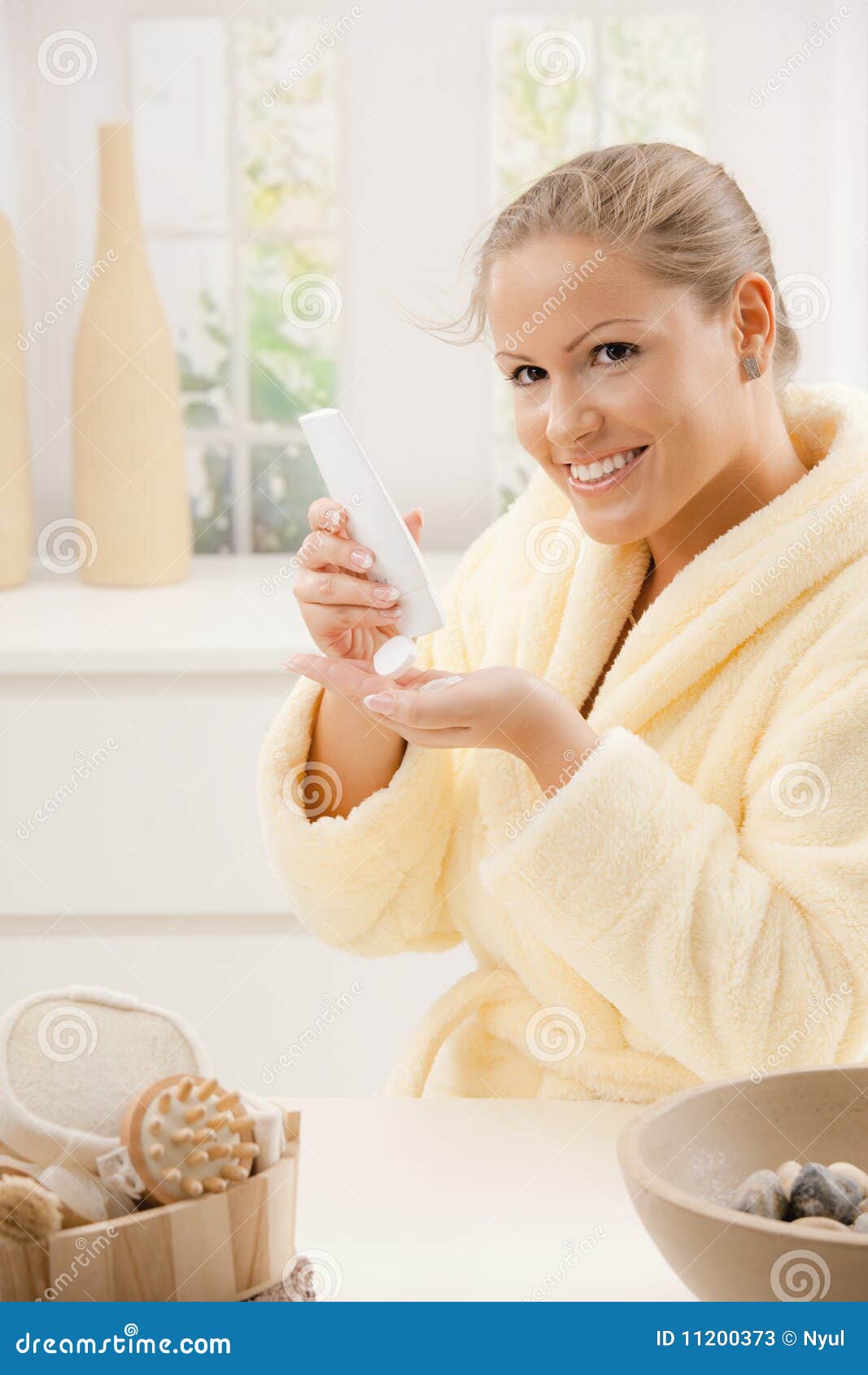 Woman using body lotion stock image. Image of glamour - 11200373