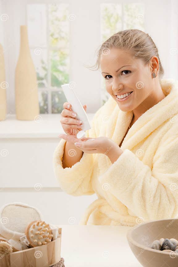 Woman using body lotion stock image. Image of glamour - 11200373