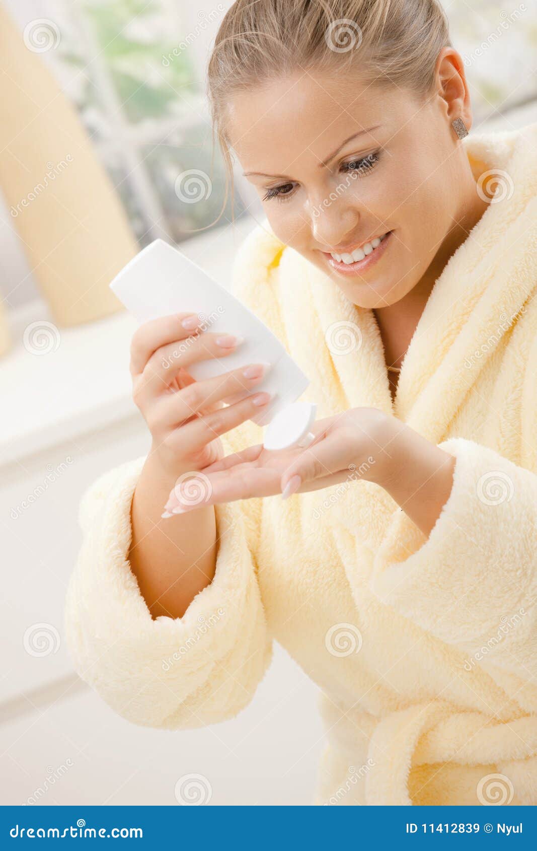 Woman using body lotion stock image. Image of care, bathroom - 11412839