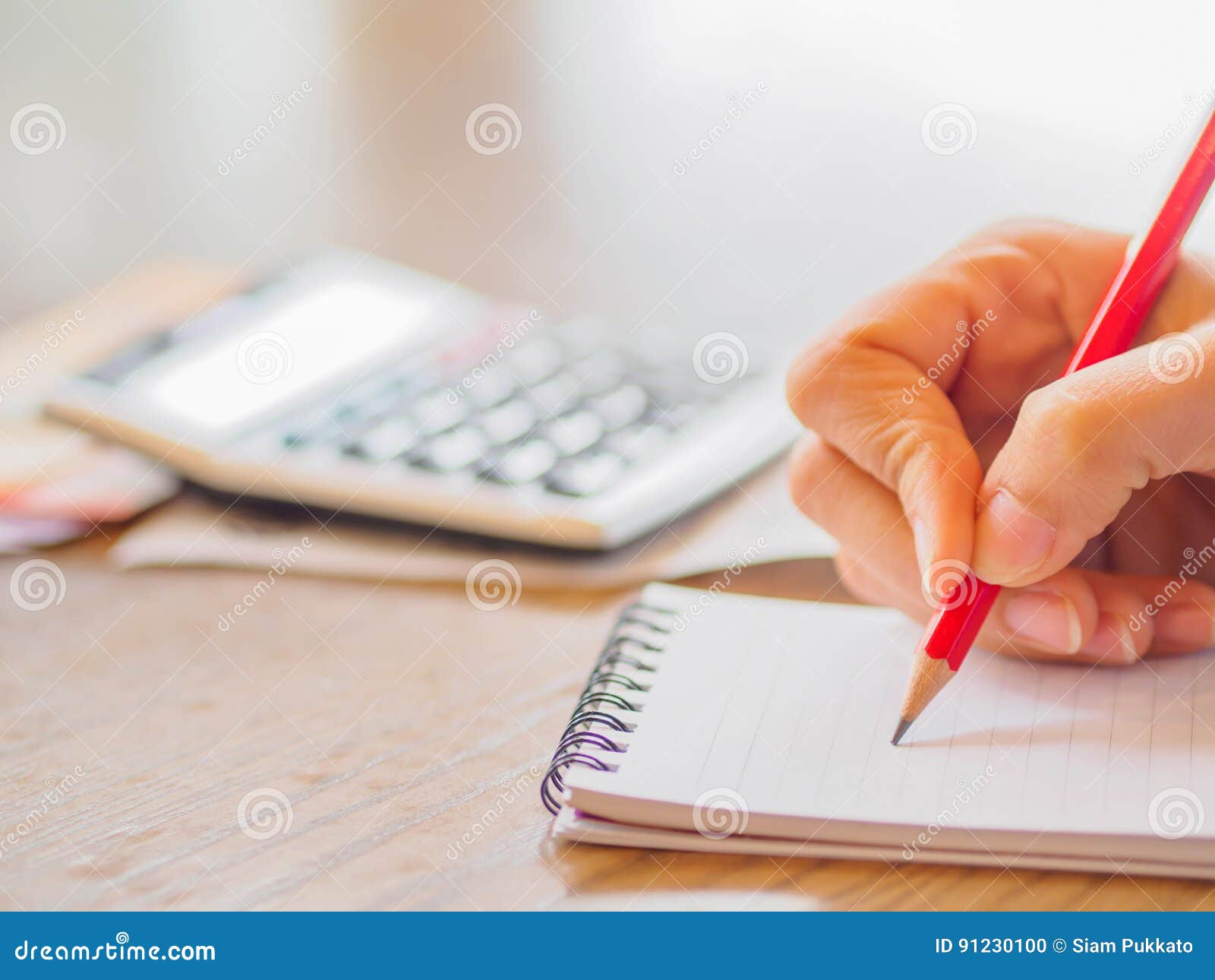 Woman Using Calculator and Thinking about Cost Stock Photo - Image of ...