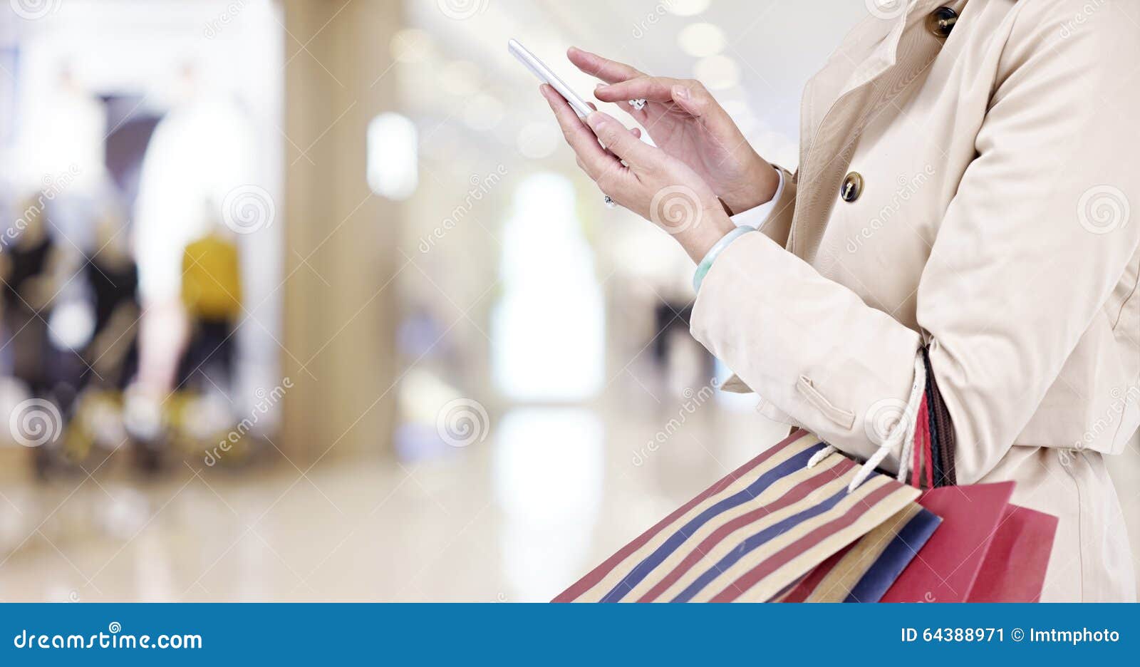 Woman Using Cellphone while Shopping Stock Image - Image of consumer ...