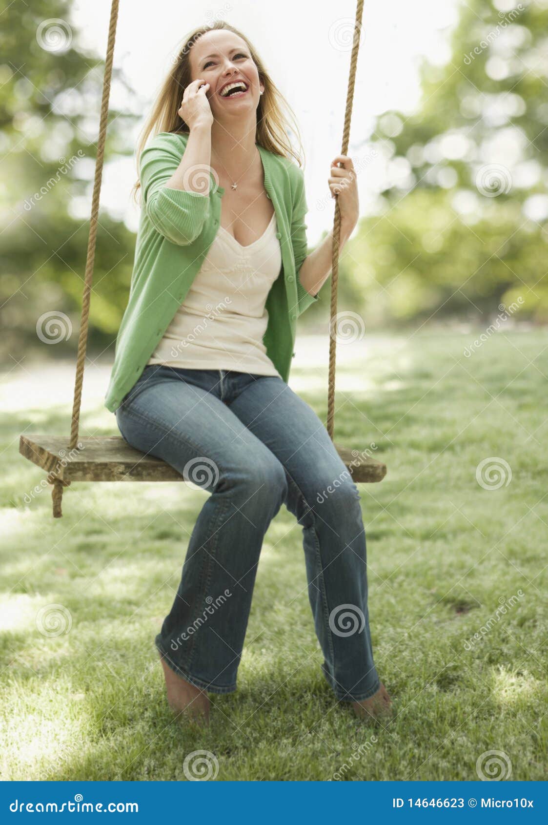 Woman Using Cellphone on a Swing Stock Image - Image of gorgeous ...