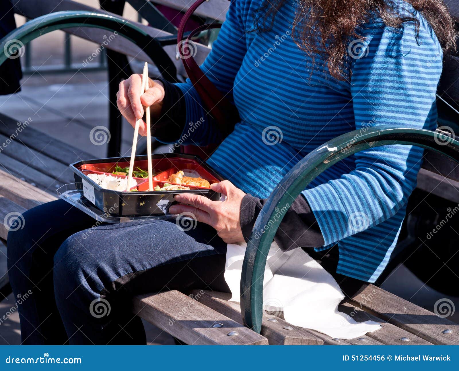 Woman Using Chopsticks Eating Lunch on Bench Stock Photo - Image of ...