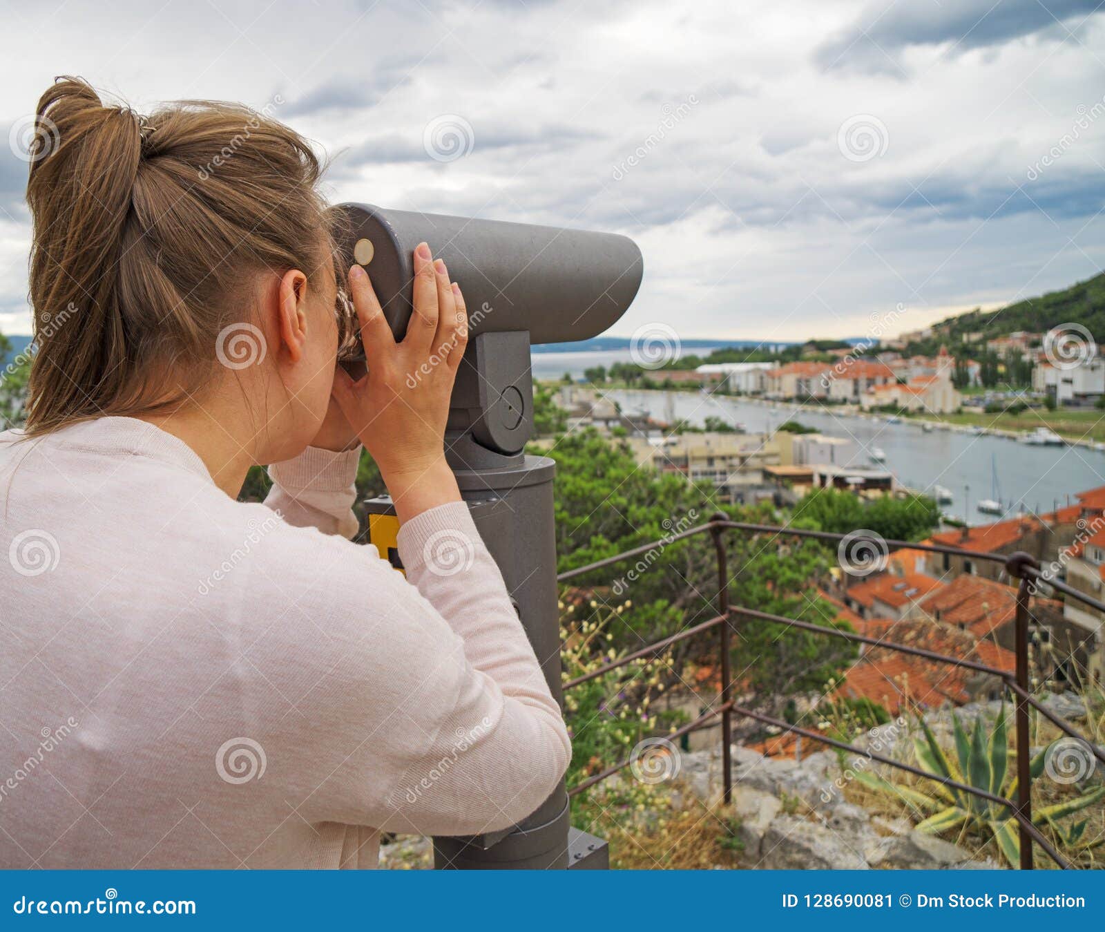 Woman using telescope. stock image. Image of person - 128690081