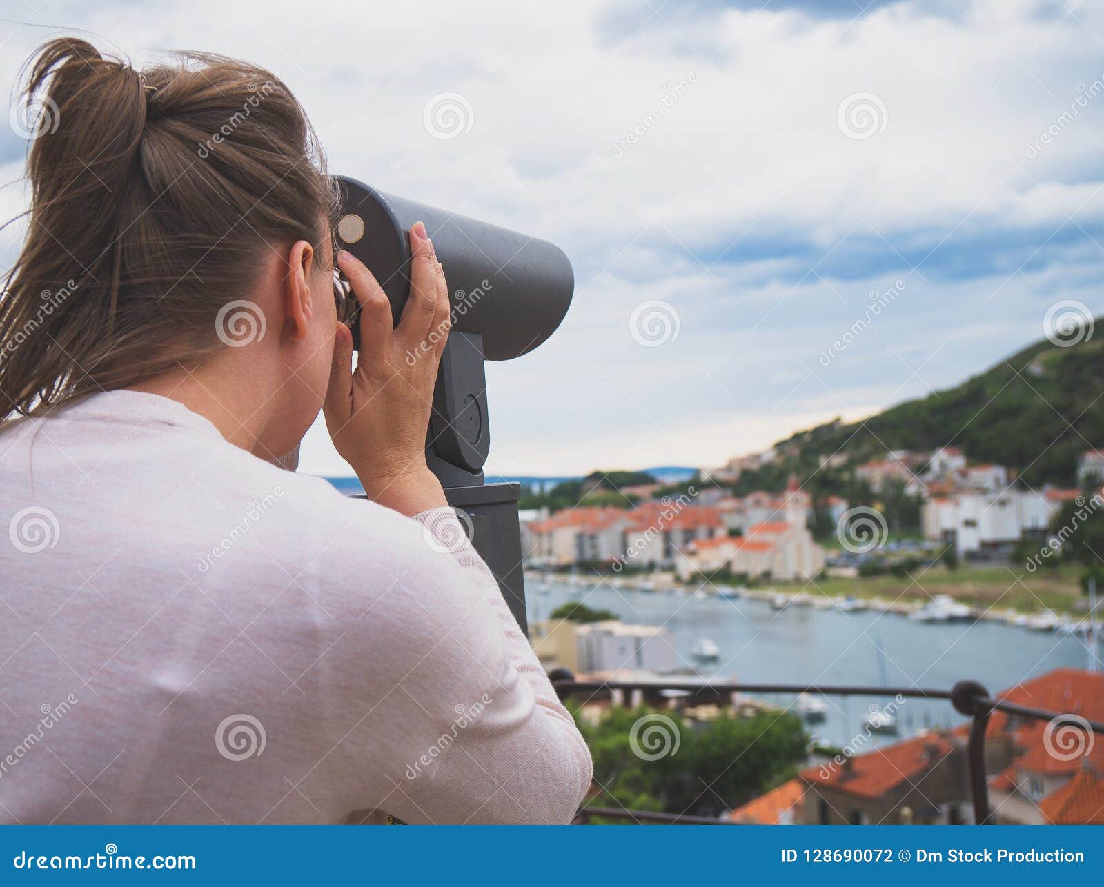 Woman using telescope. stock photo. Image of city, duce - 128690072